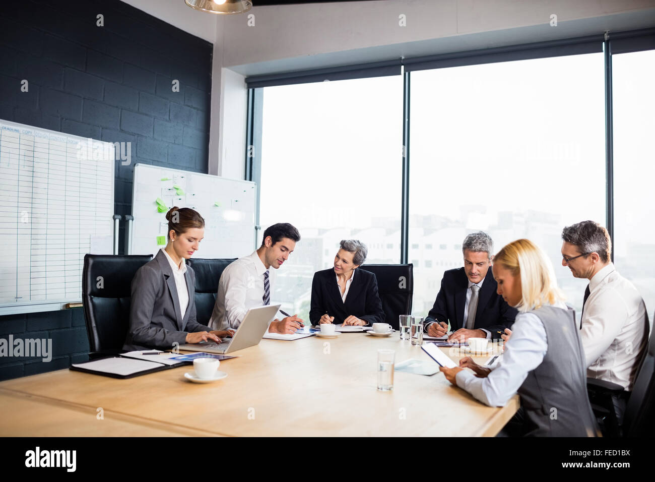 Business team having a meeting Stock Photo - Alamy