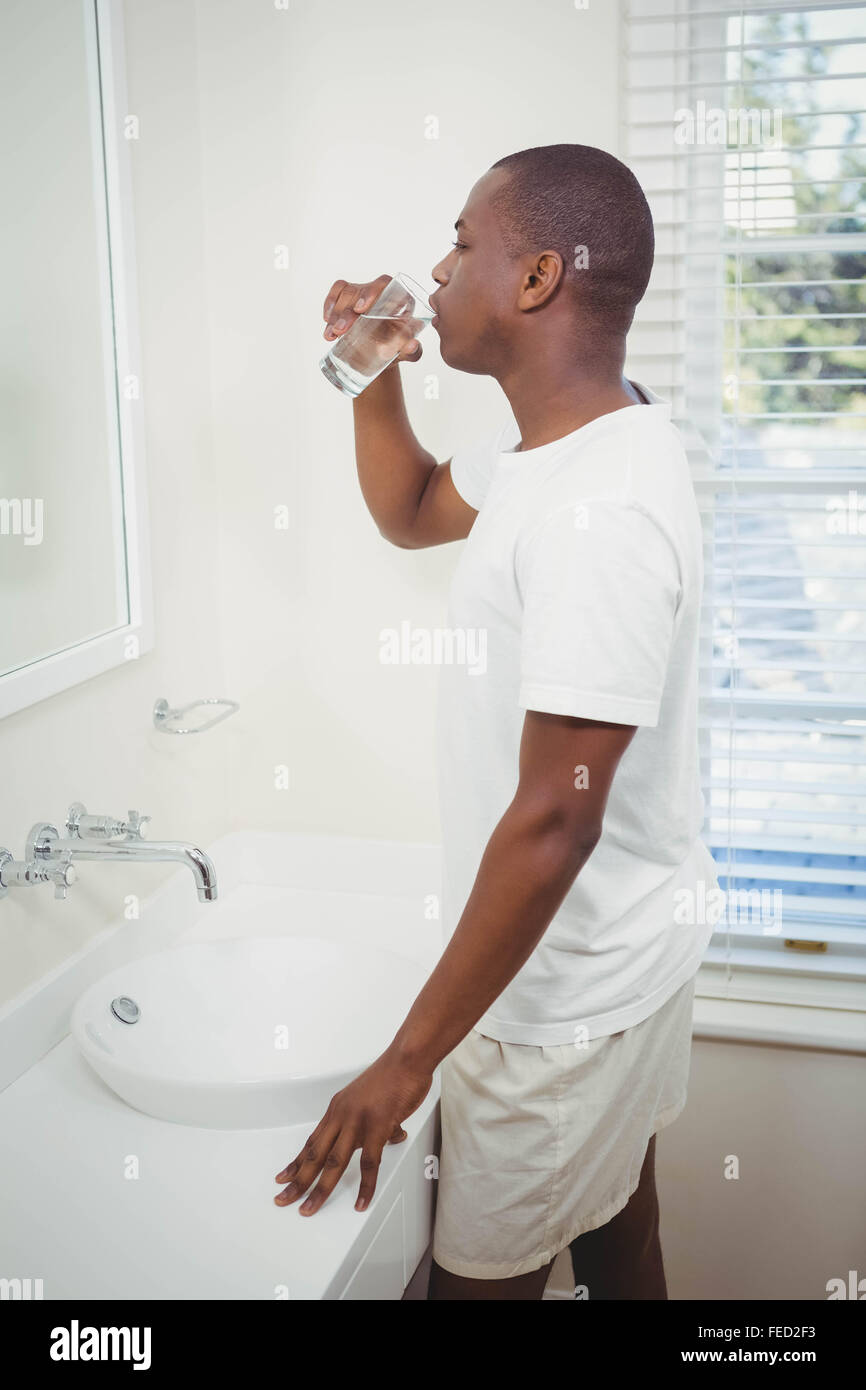 Handsome man drinking water Stock Photo - Alamy