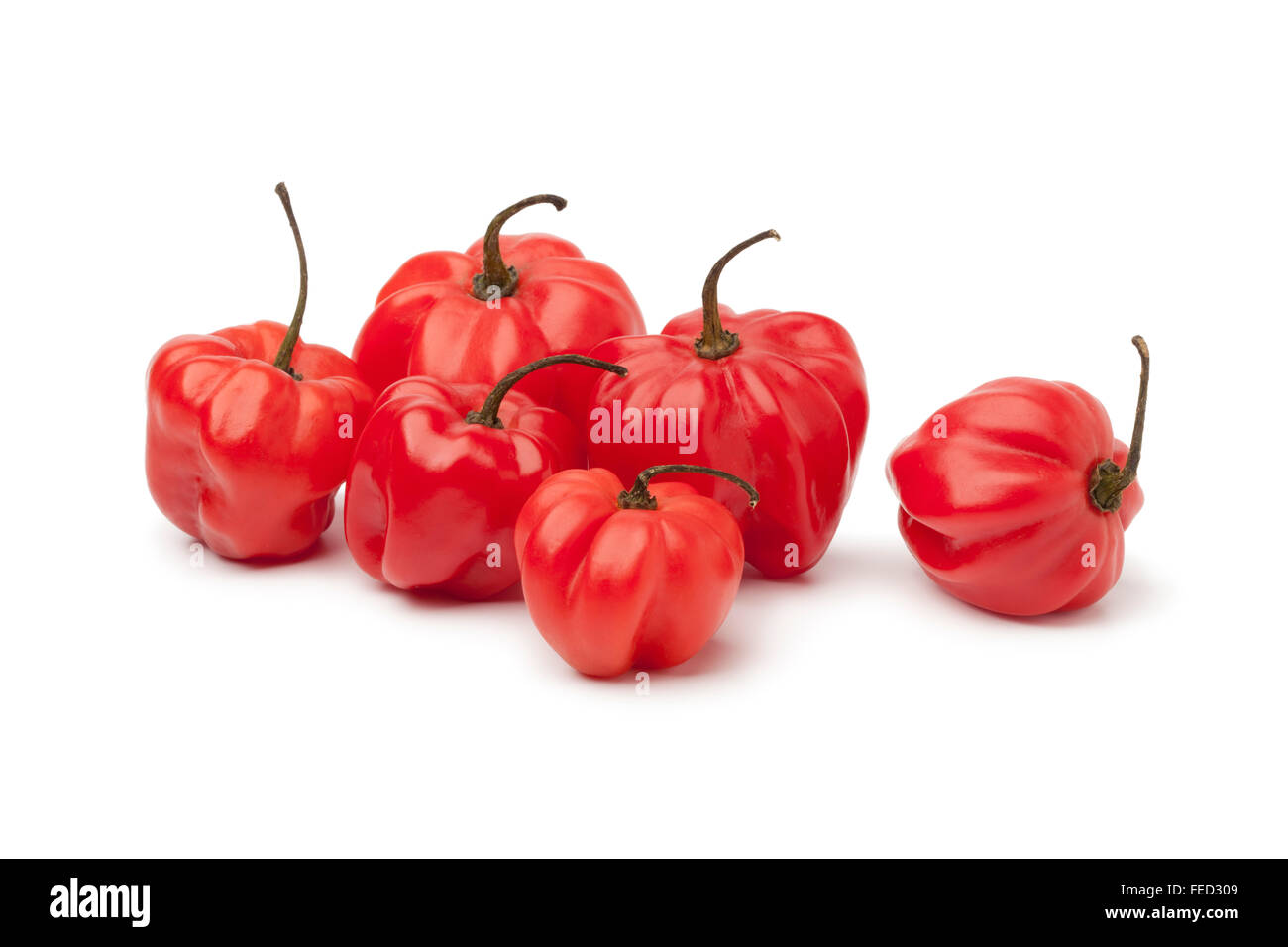 Red Scotch bonnet chili peppers on white background Stock Photo - Alamy