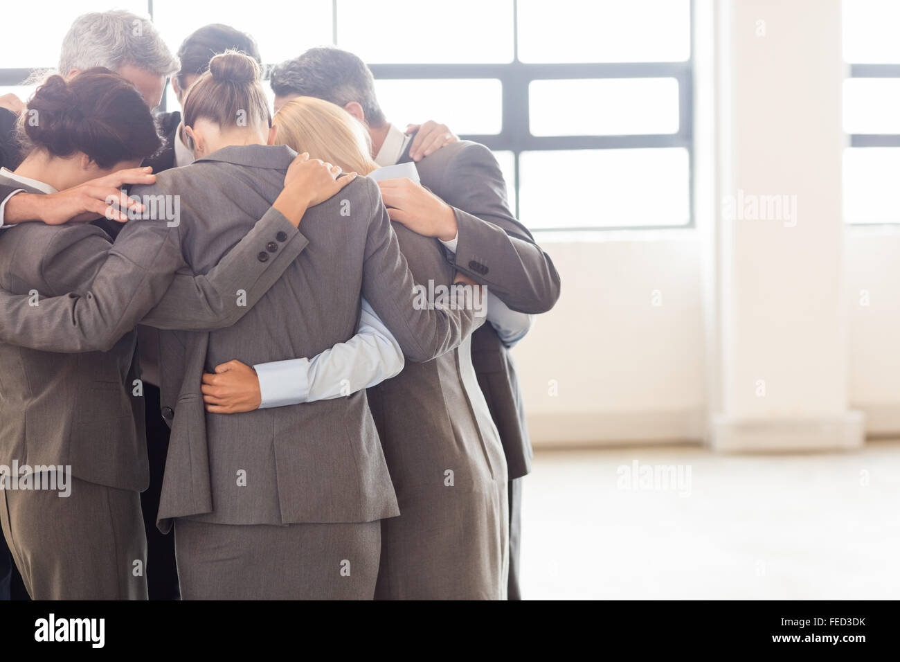 Team hugging huddling hi-res stock photography and images - Alamy