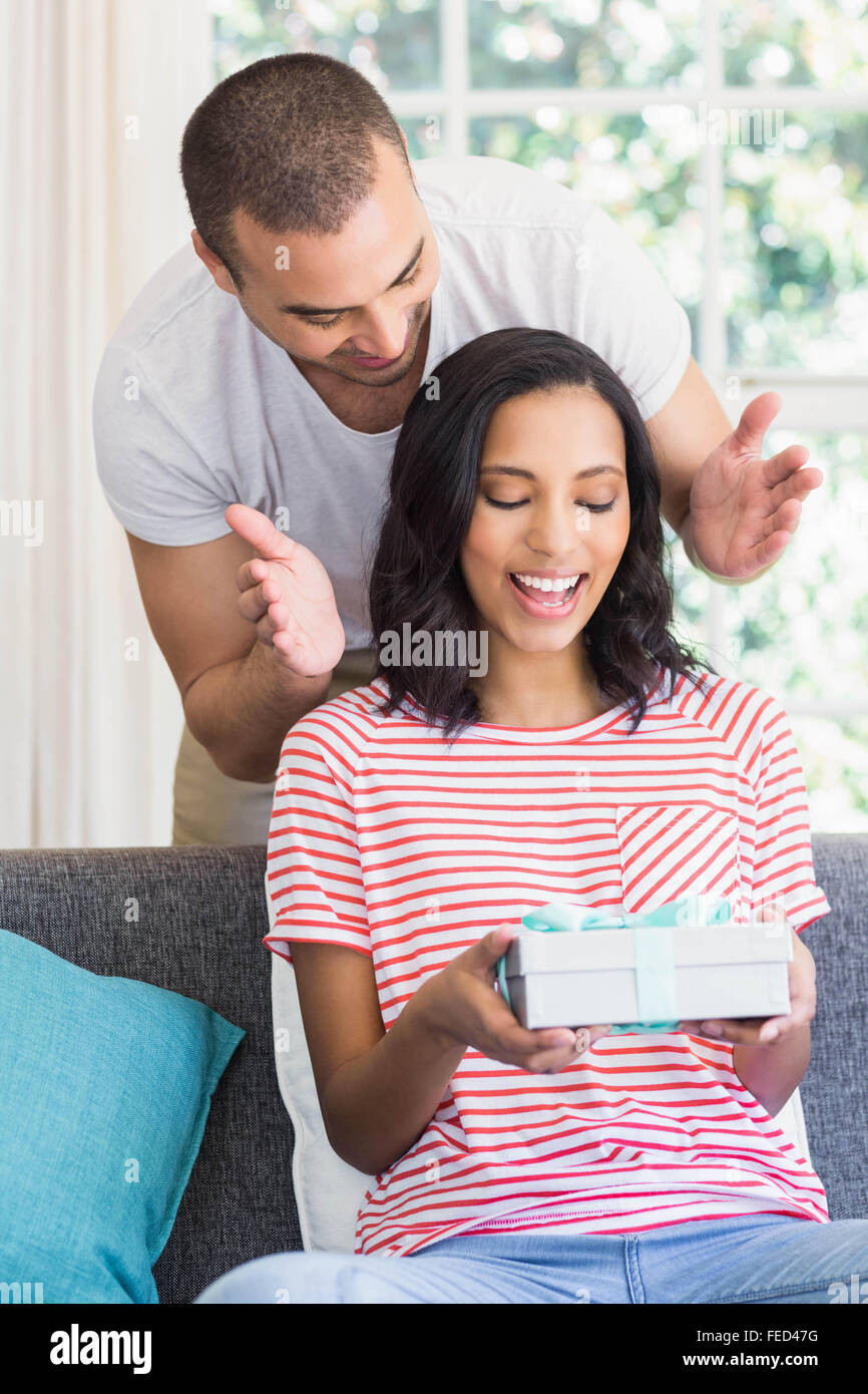 Happy couple receiving a gift Stock Photo - Alamy