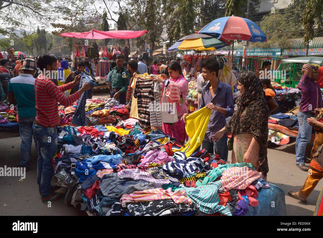 Dhaka, Bangladesh. 5th February, 2016. Bangladeshi clothes vendors are ...