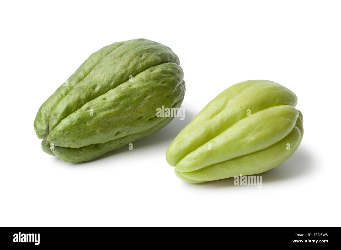 Fresh whole chayotes on white background Stock Photo - Alamy