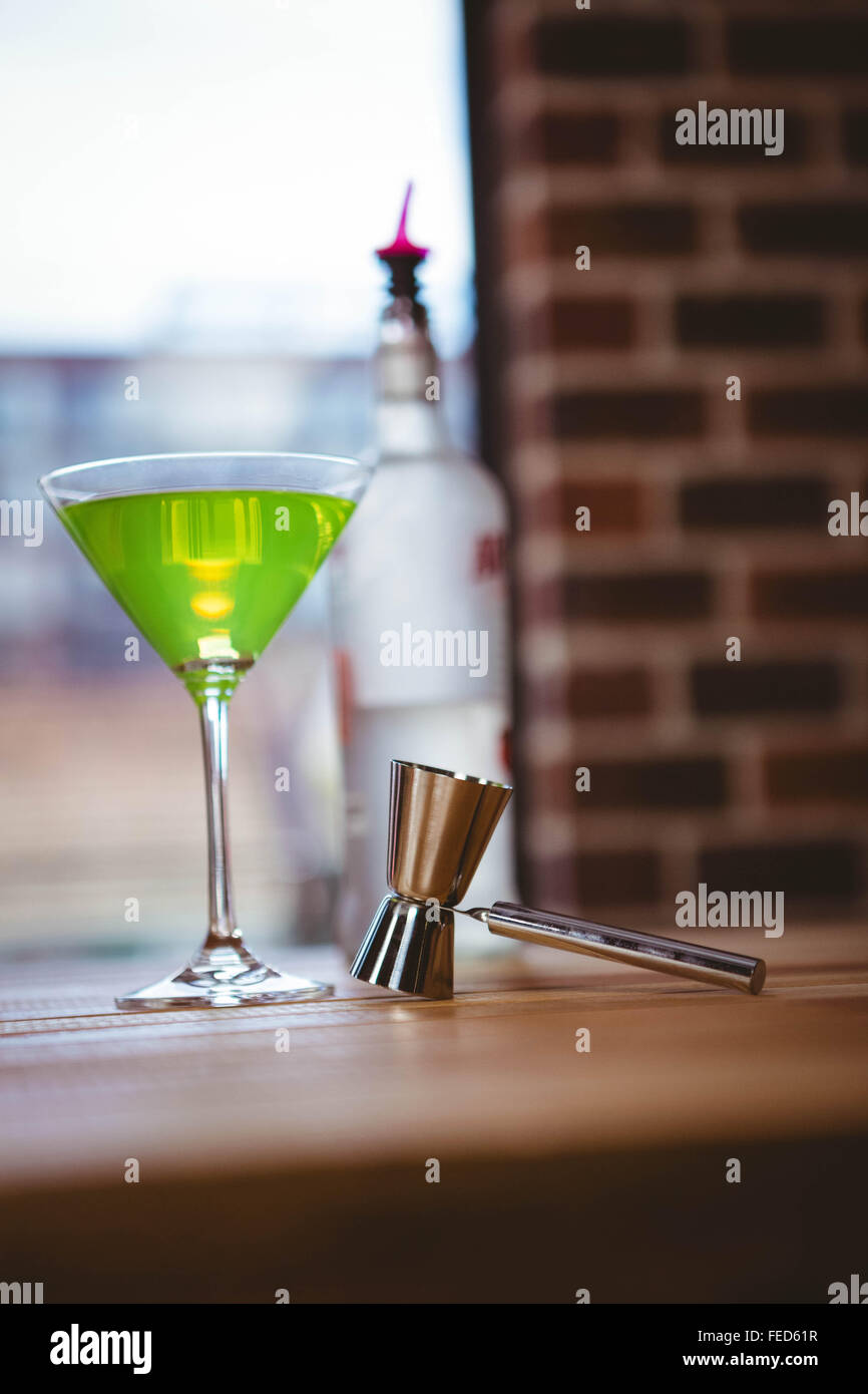 Cocktail glass on table Stock Photo - Alamy