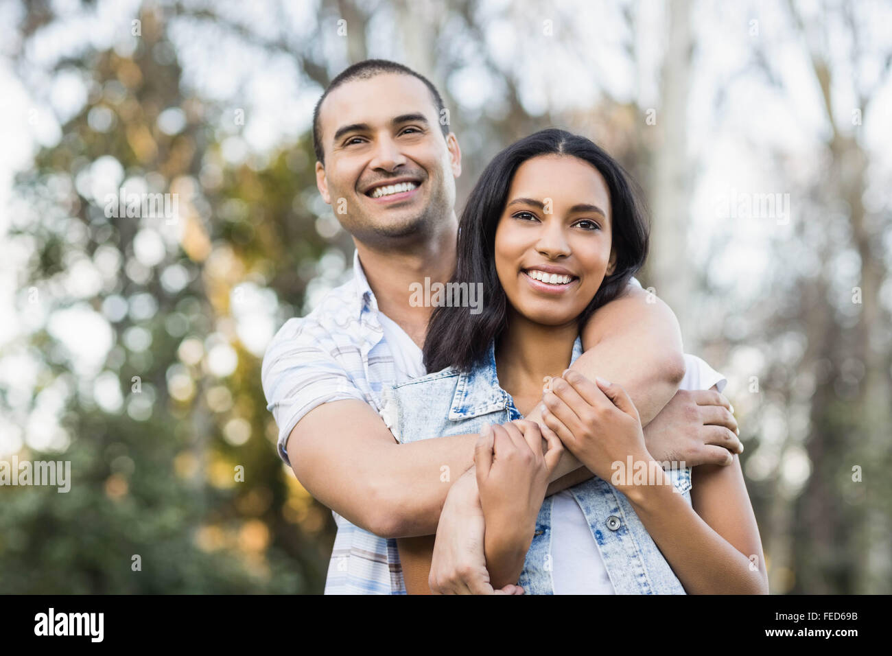Cute couple hugging Stock Photo - Alamy