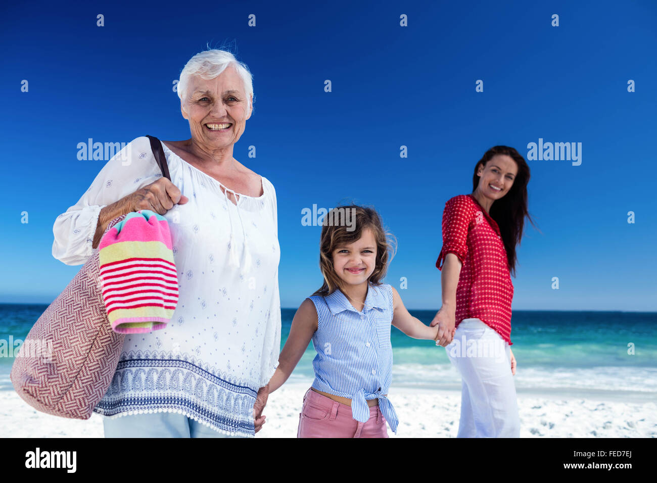 Multi generation family holding hands Stock Photo - Alamy