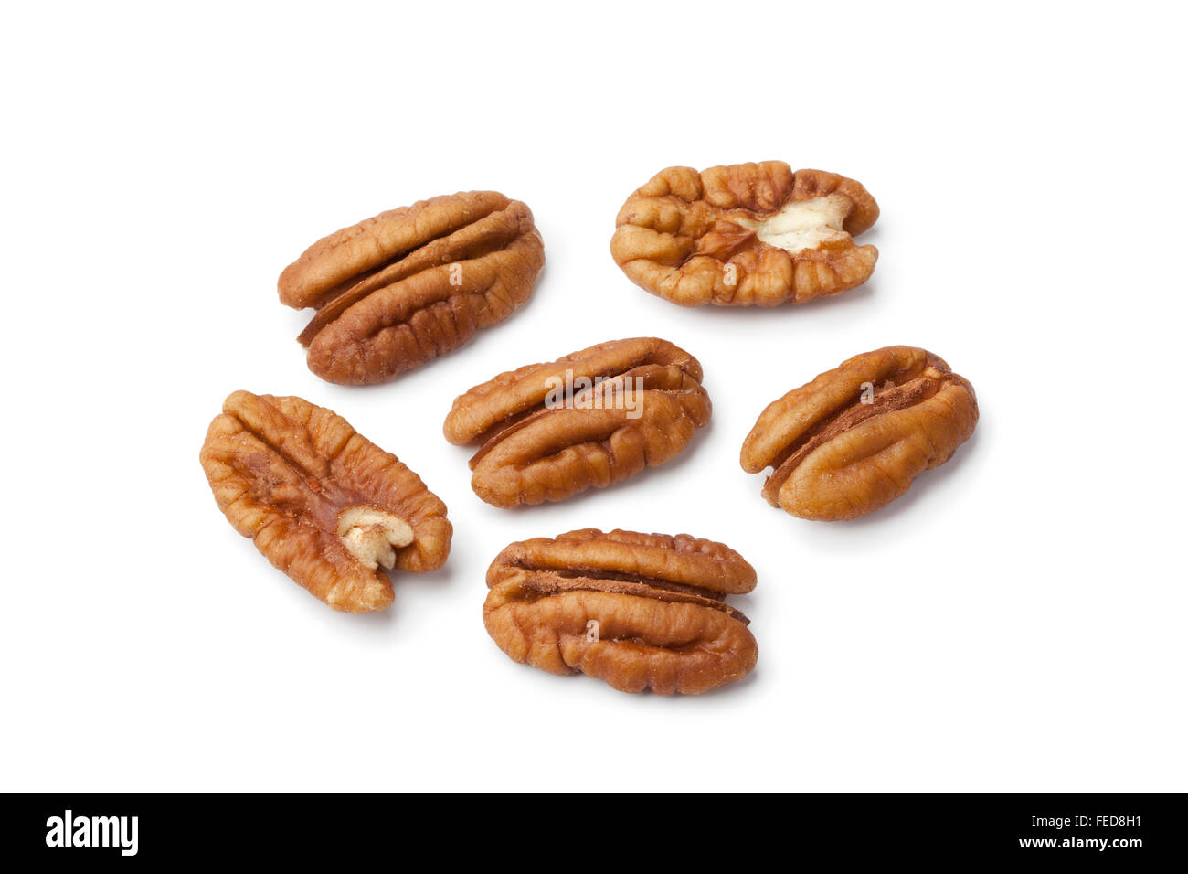 Peeled Pecan nuts on white background Stock Photo - Alamy
