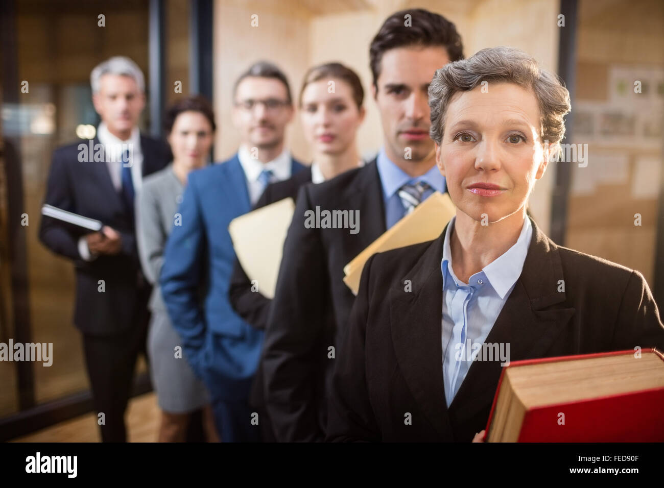 Business team looking at the camera Stock Photo - Alamy