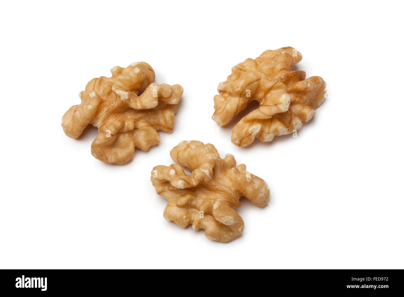 Peeled walnuts on white background Stock Photo - Alamy