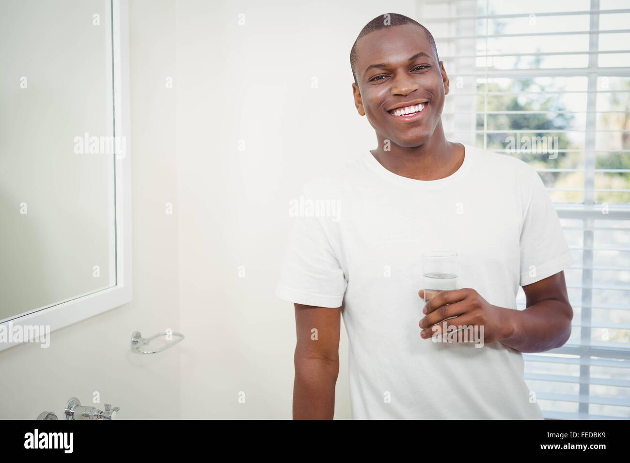 Handsome man drinking water Stock Photo - Alamy