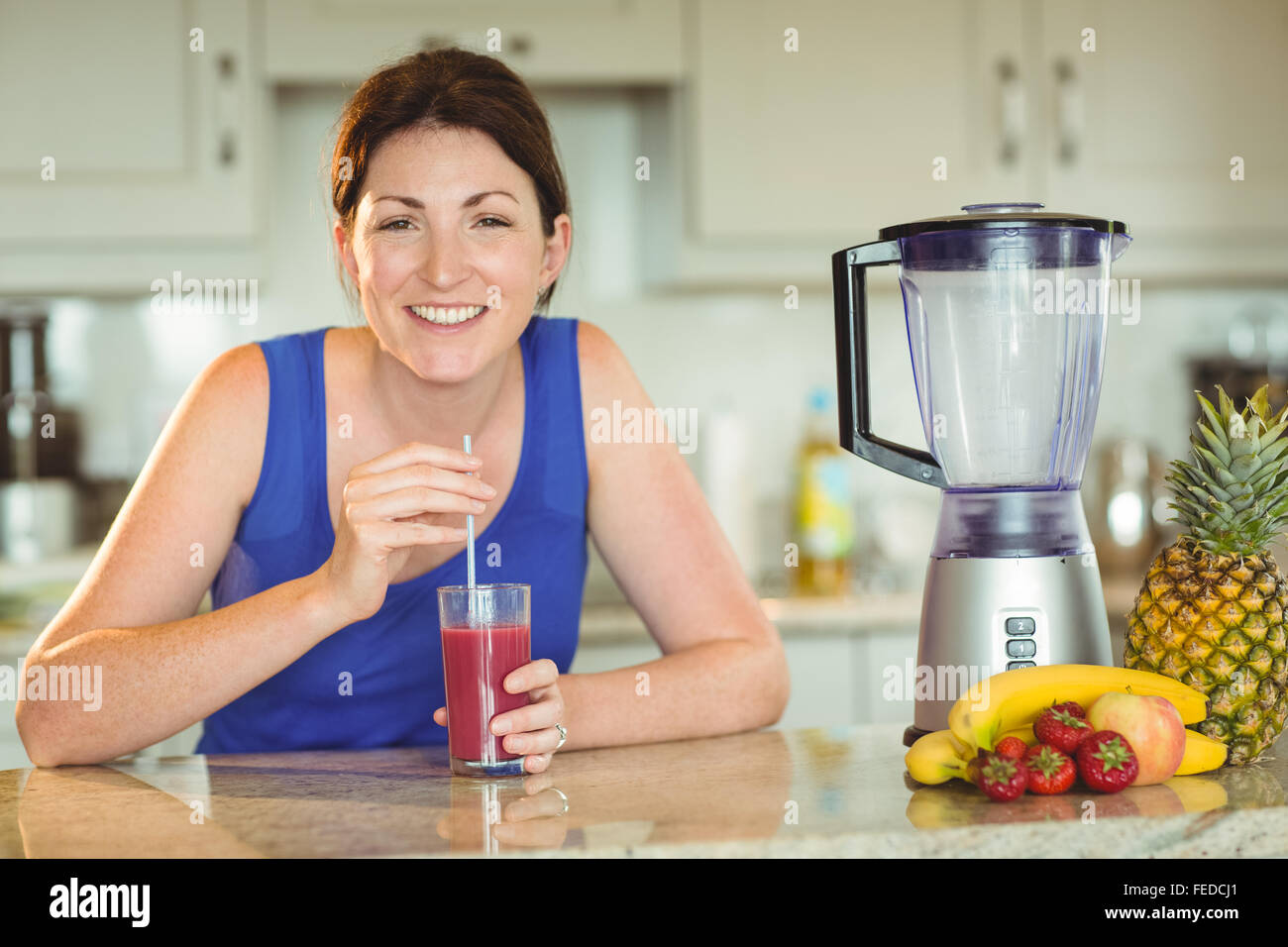 Woman drinking smoothie Stock Photo - Alamy
