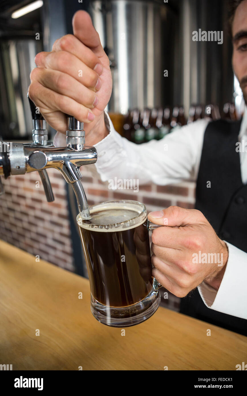 Pulling the tap hi-res stock photography and images - Alamy