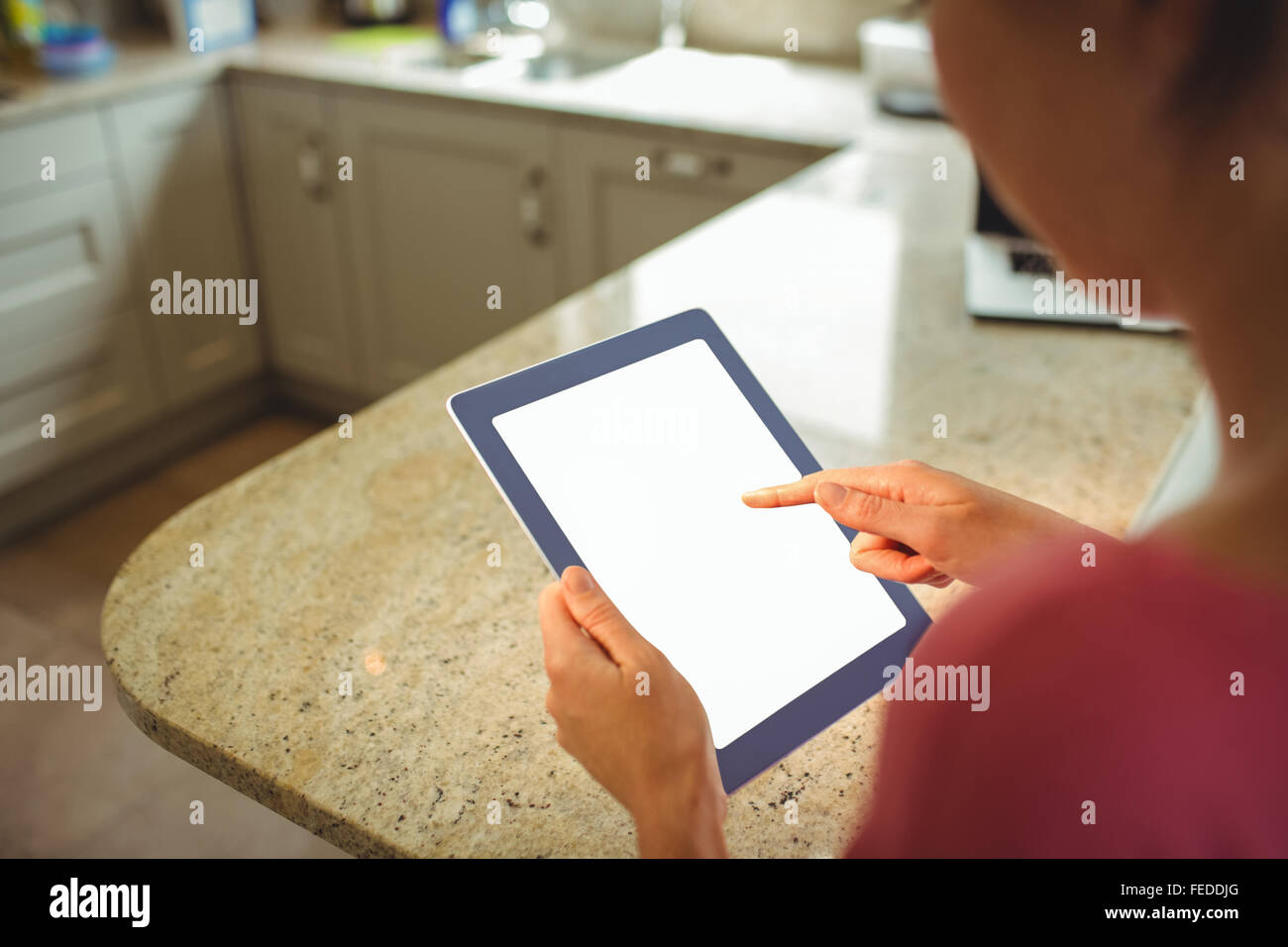 Woman using her tablet Stock Photo - Alamy