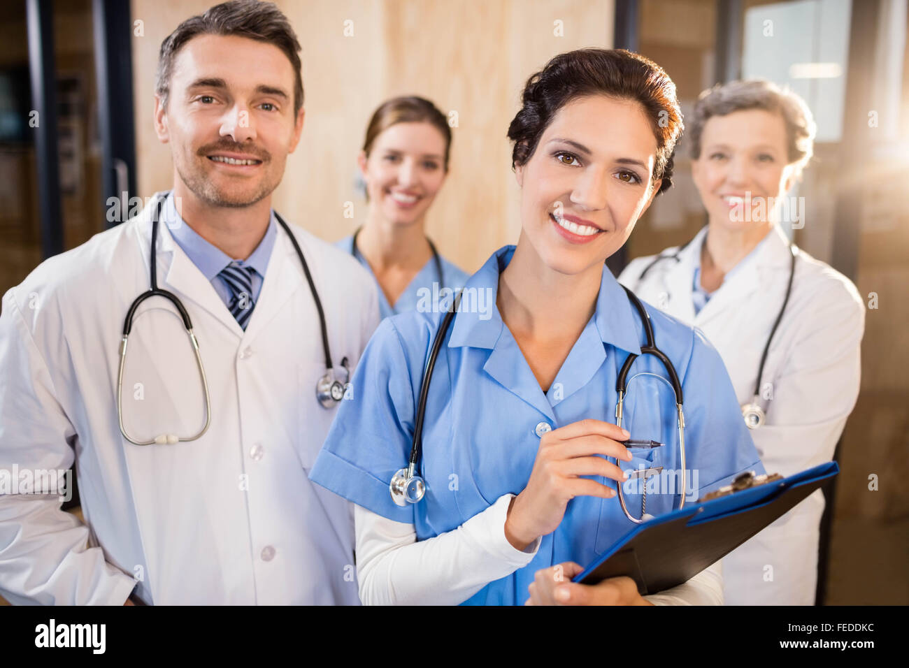 Medical team smiling at camera together Stock Photo - Alamy