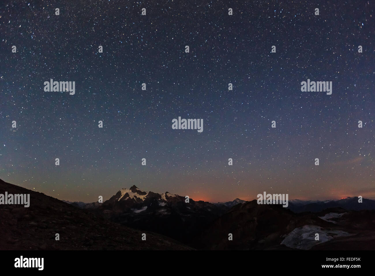 Red glow from distant forest fires at night with Mount Shuksan and ...