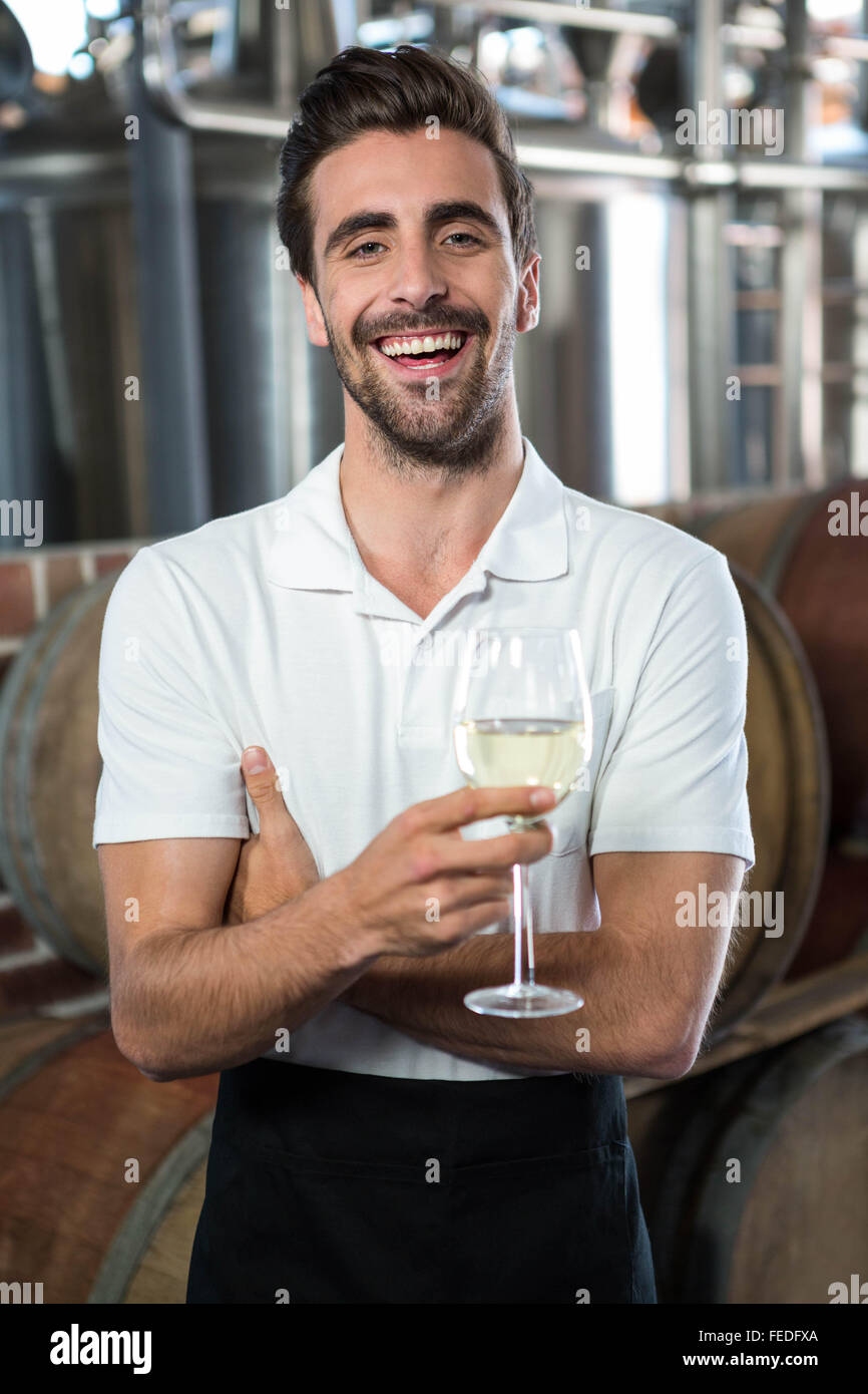 Handsome man holding a glass of wine Stock Photo - Alamy