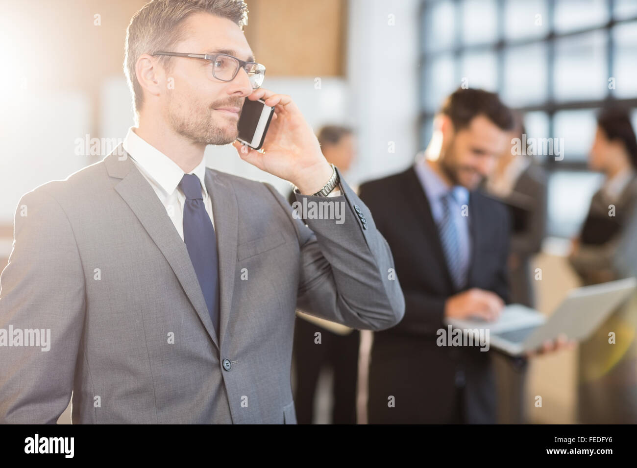 Smart businessman calling partners using hi-res stock photography and ...