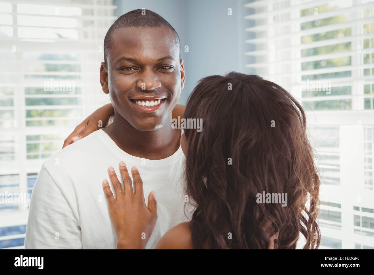 Ethnic couple hugging Stock Photo - Alamy