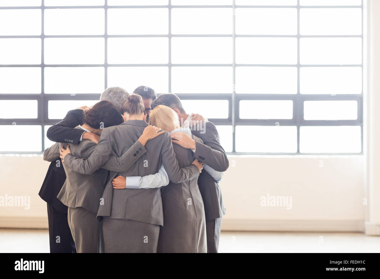 Team hugging huddling hi-res stock photography and images - Alamy