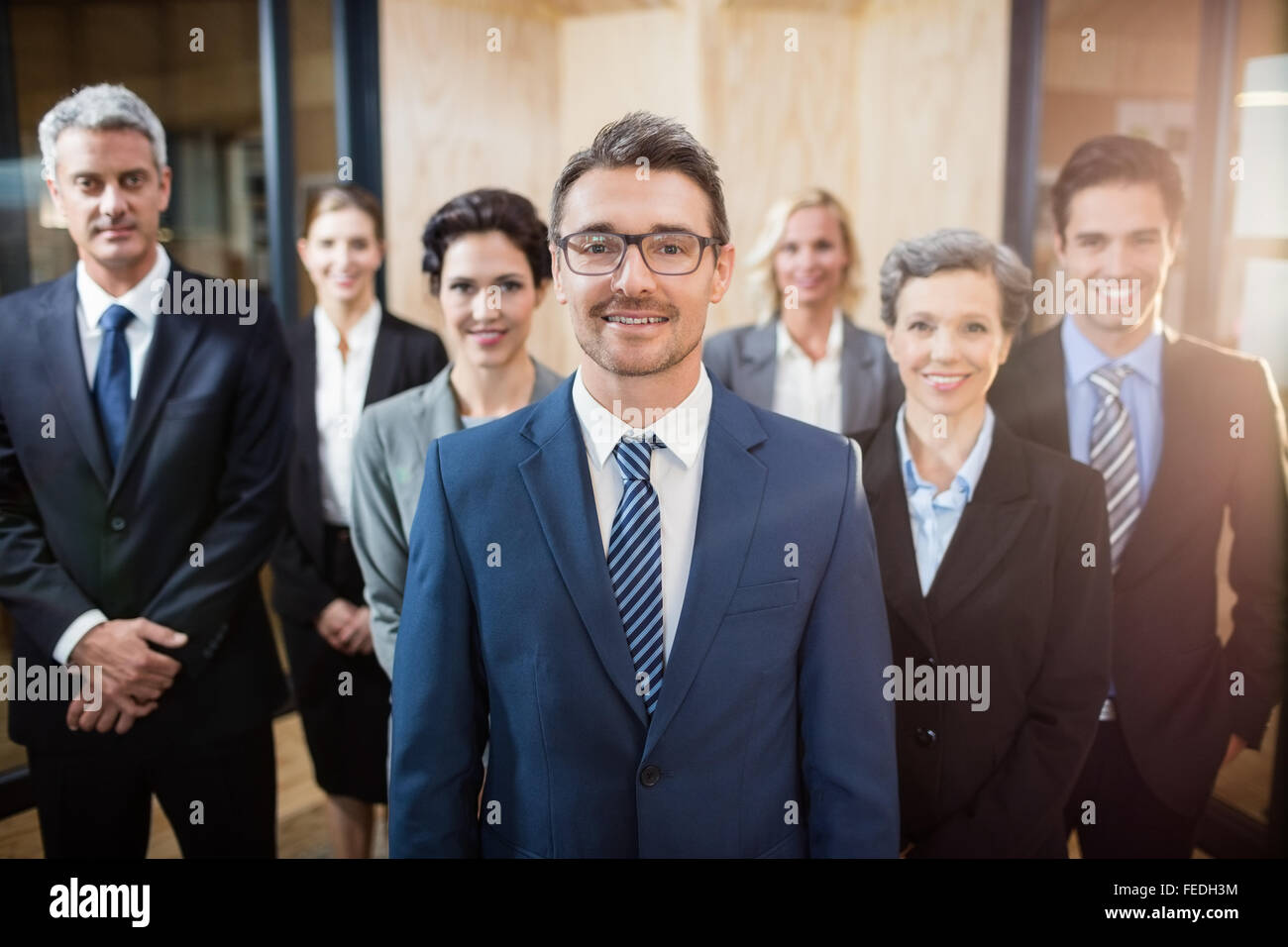 Business team smiling at the camera Stock Photo - Alamy