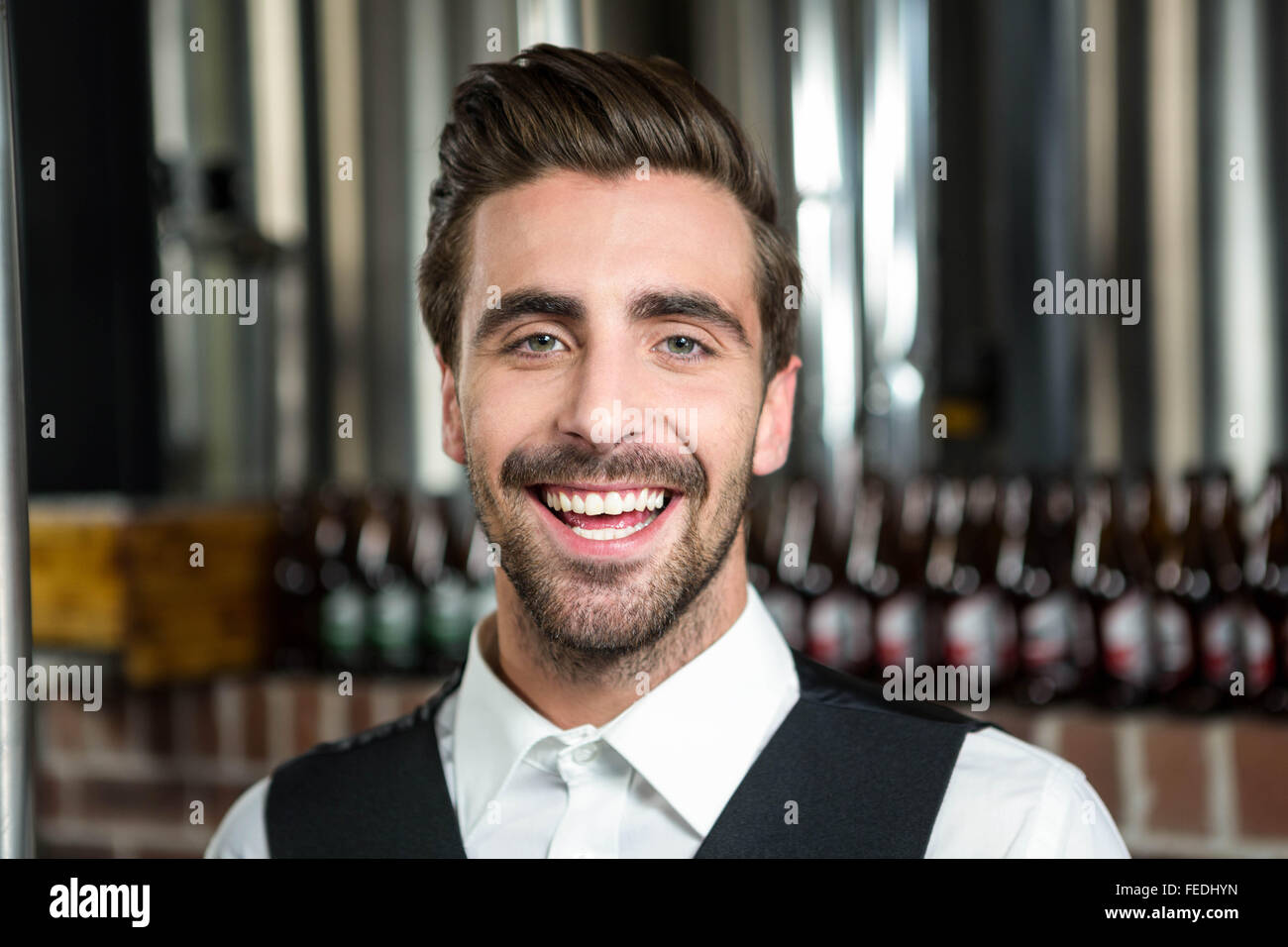 Handsome barman smiling at camera Stock Photo - Alamy