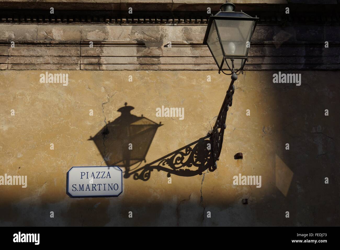 Street light cast a shadow in the morning sun Stock Photo - Alamy