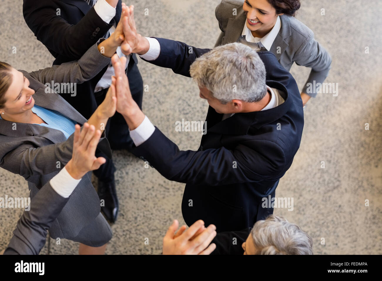 Business team putting their hands together Stock Photo - Alamy