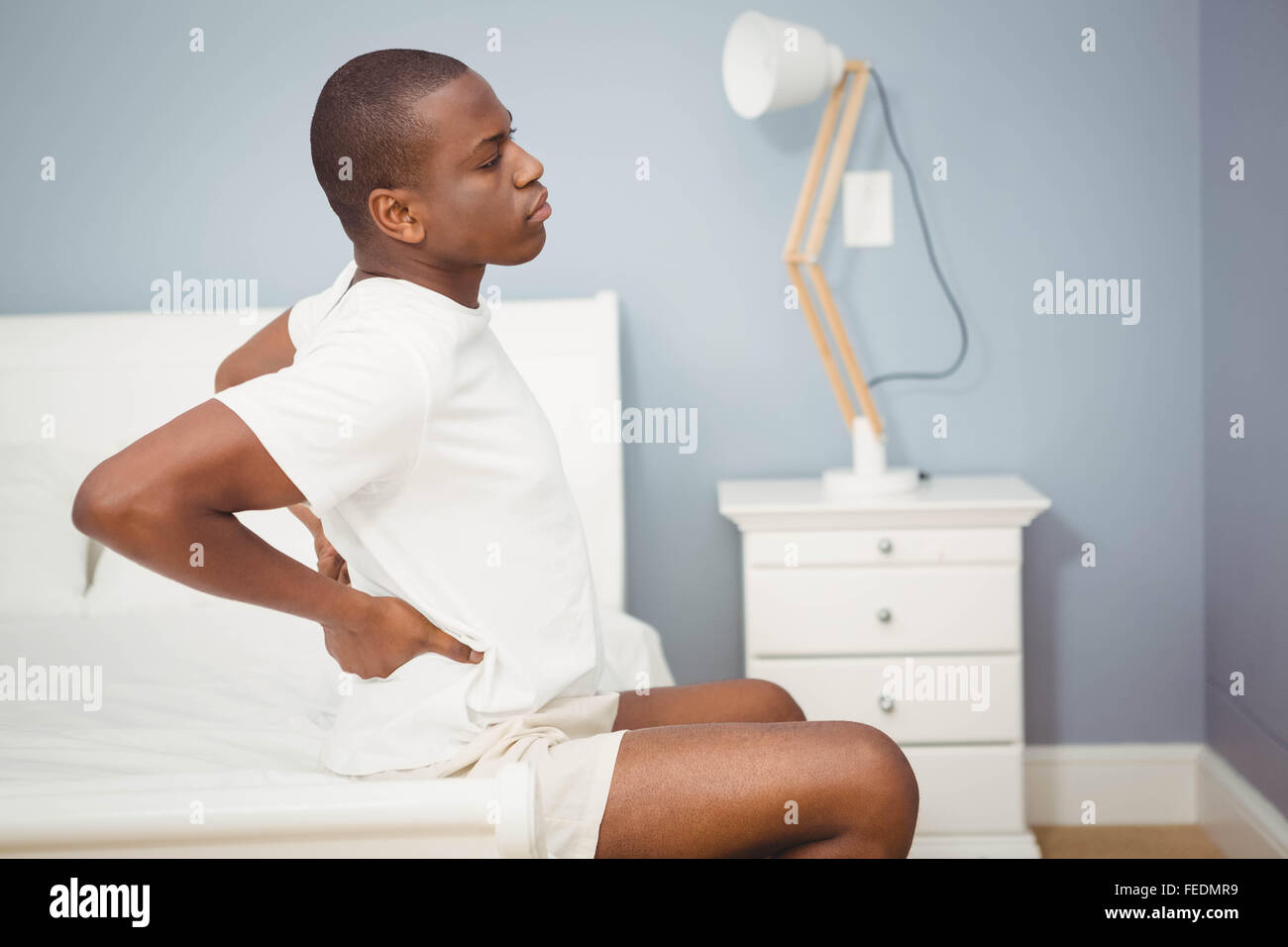 Man having back pain Stock Photo - Alamy