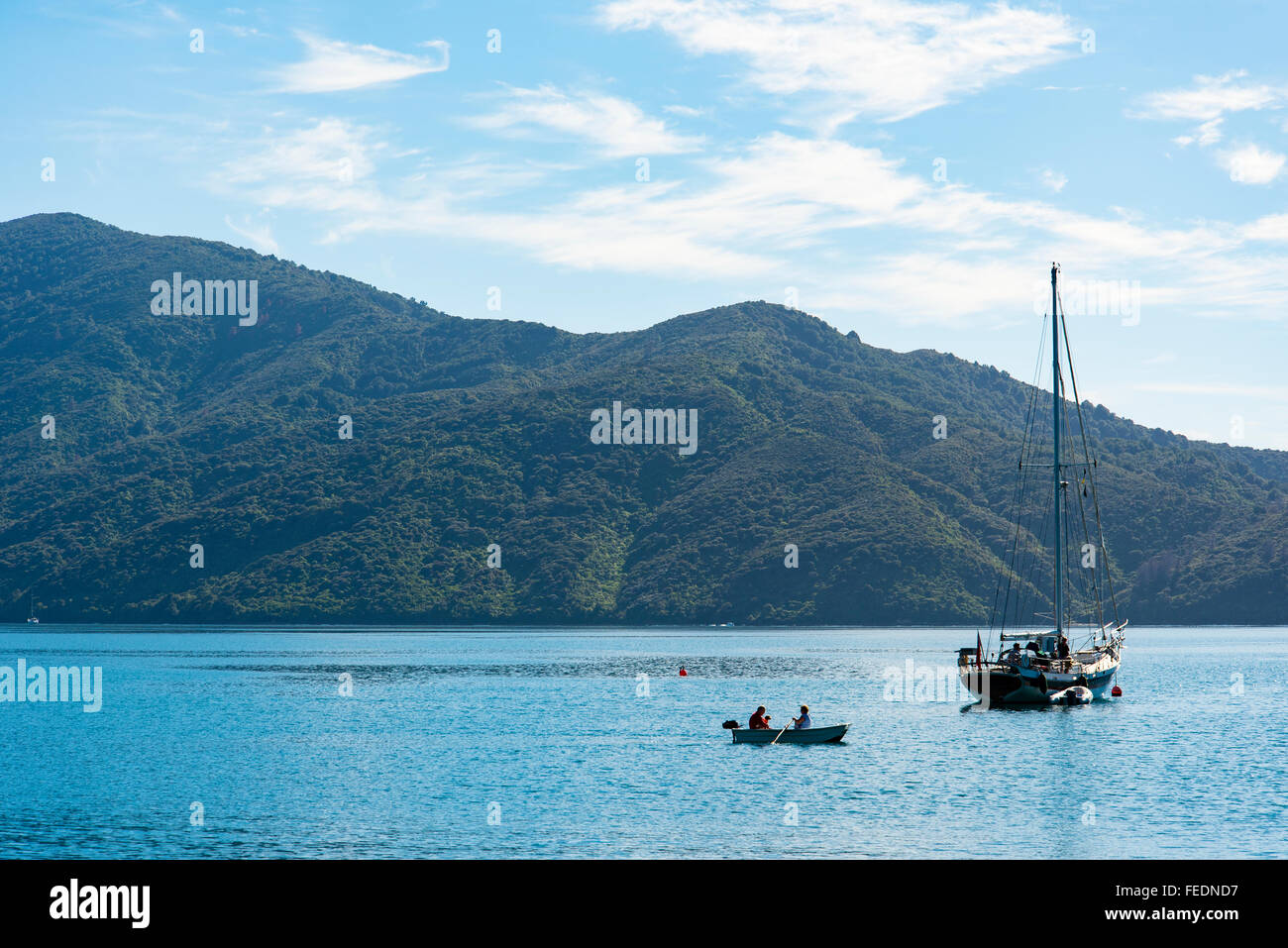 Dinghy and yacht at Punga Cove Endeavour Inlet Marlborough Sounds New ...