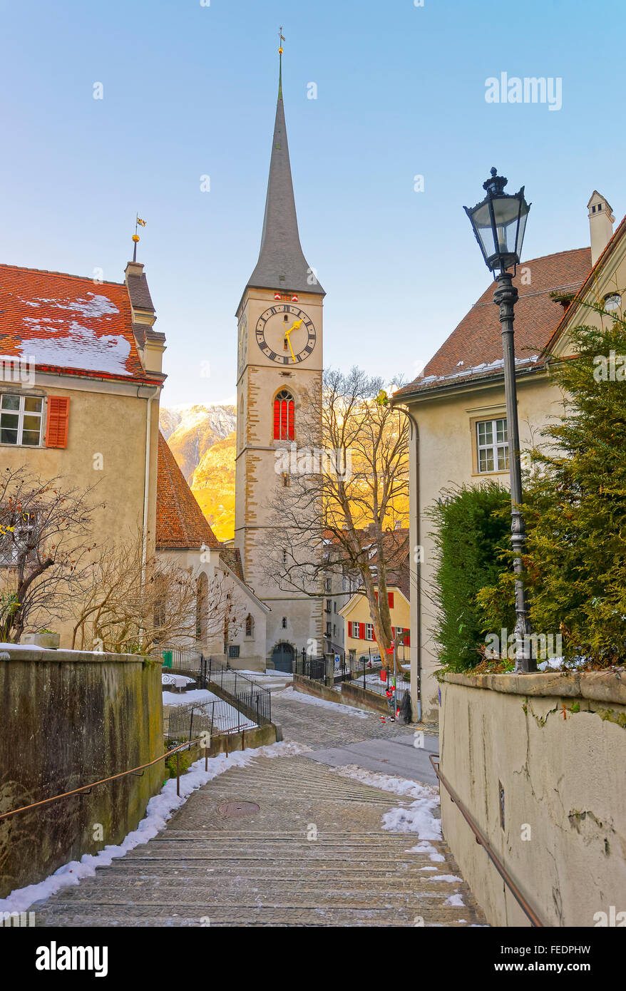 Belfry of Church of St Martin at sunrise in Chur. Chur is the capital ...