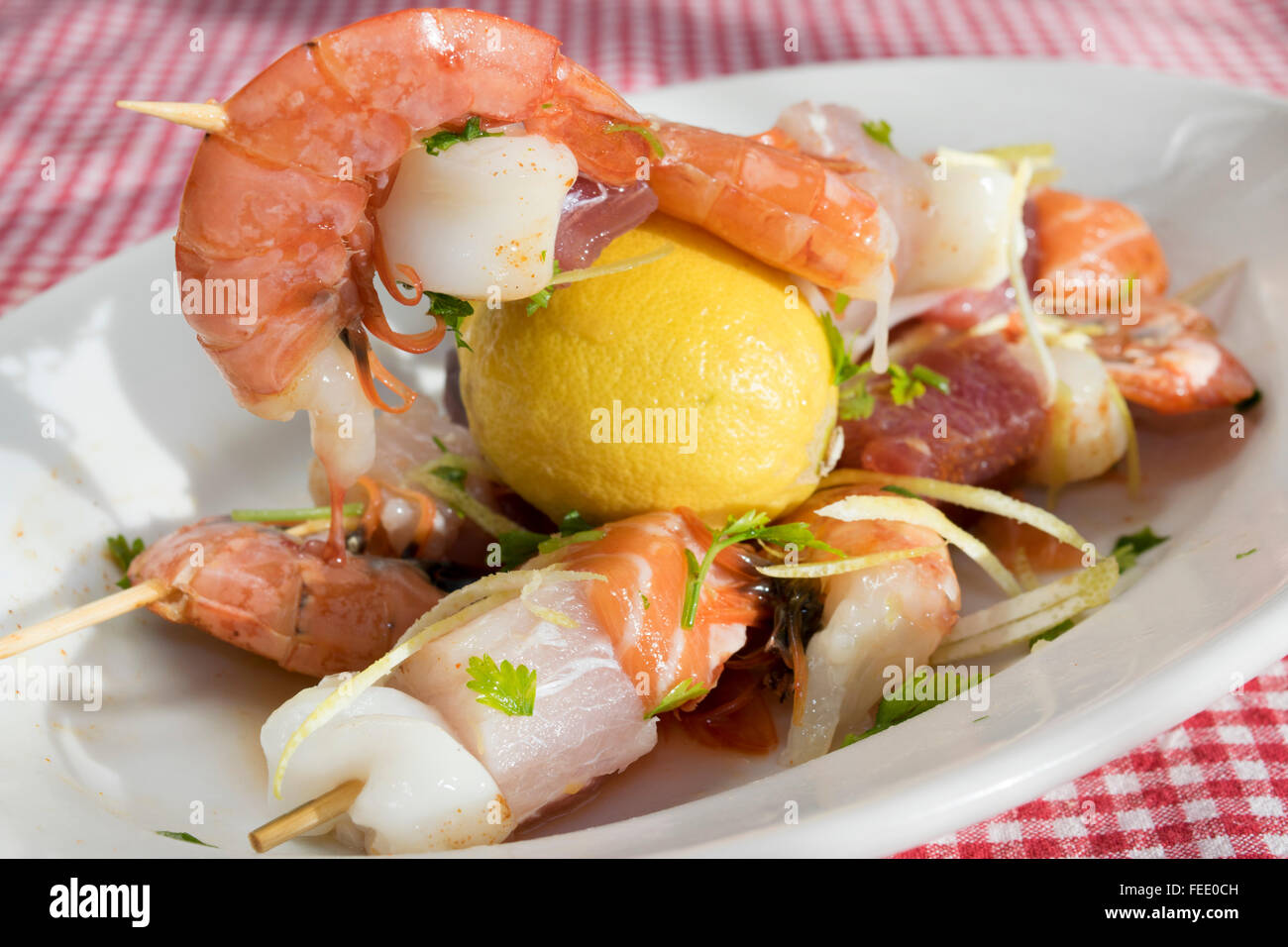 skewers of fresh fish with shrimps salmon tuna and swordfish Stock ...