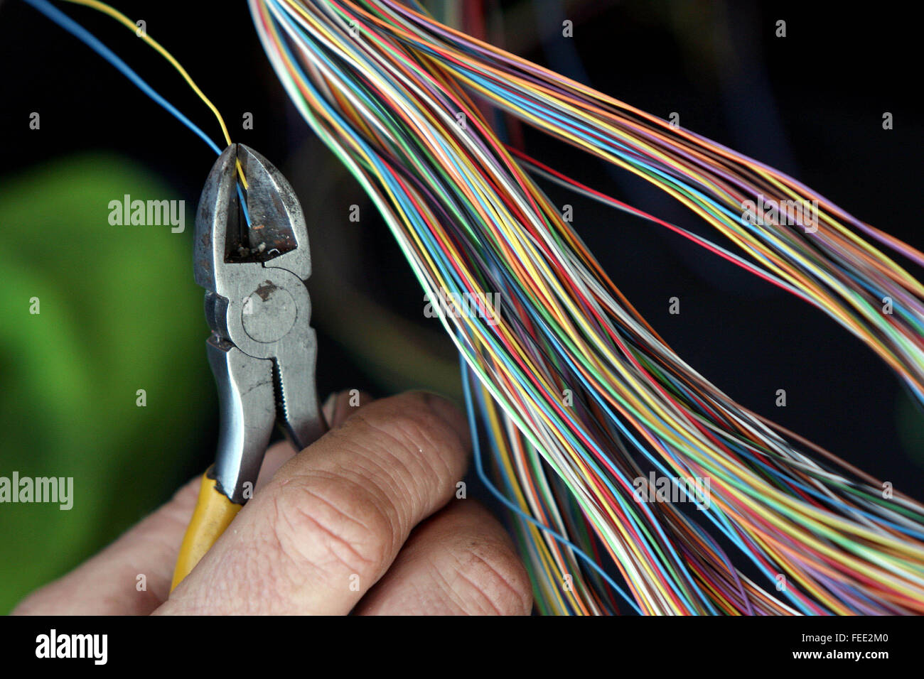 BT British Telecom Open Reach engineer fixing a fault at a junction box ...