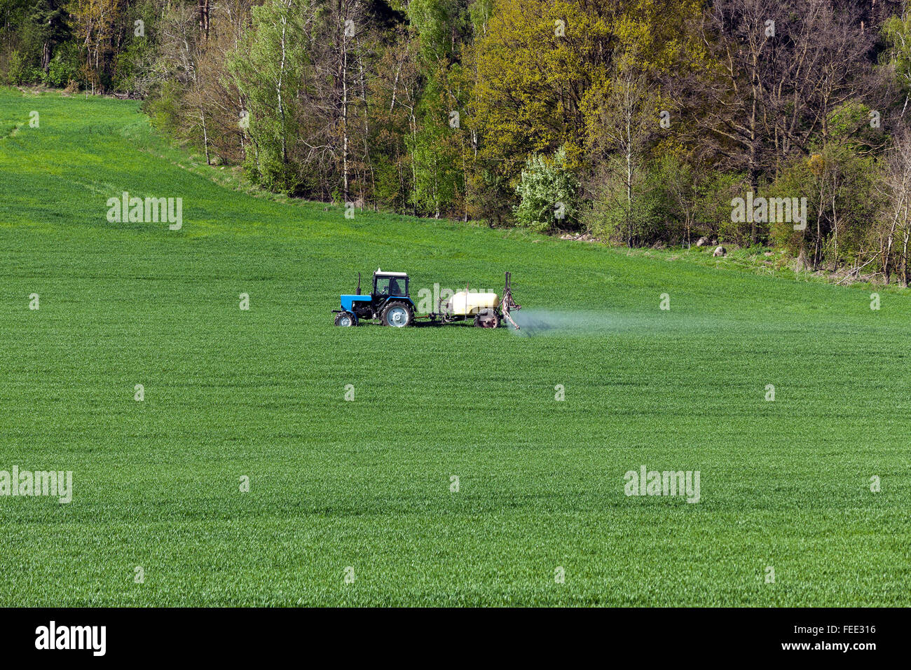 tractor in the field Stock Photo - Alamy