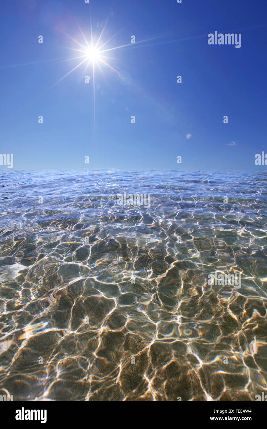 Beautiful transparent sea and shining summer sun in sky Stock Photo - Alamy