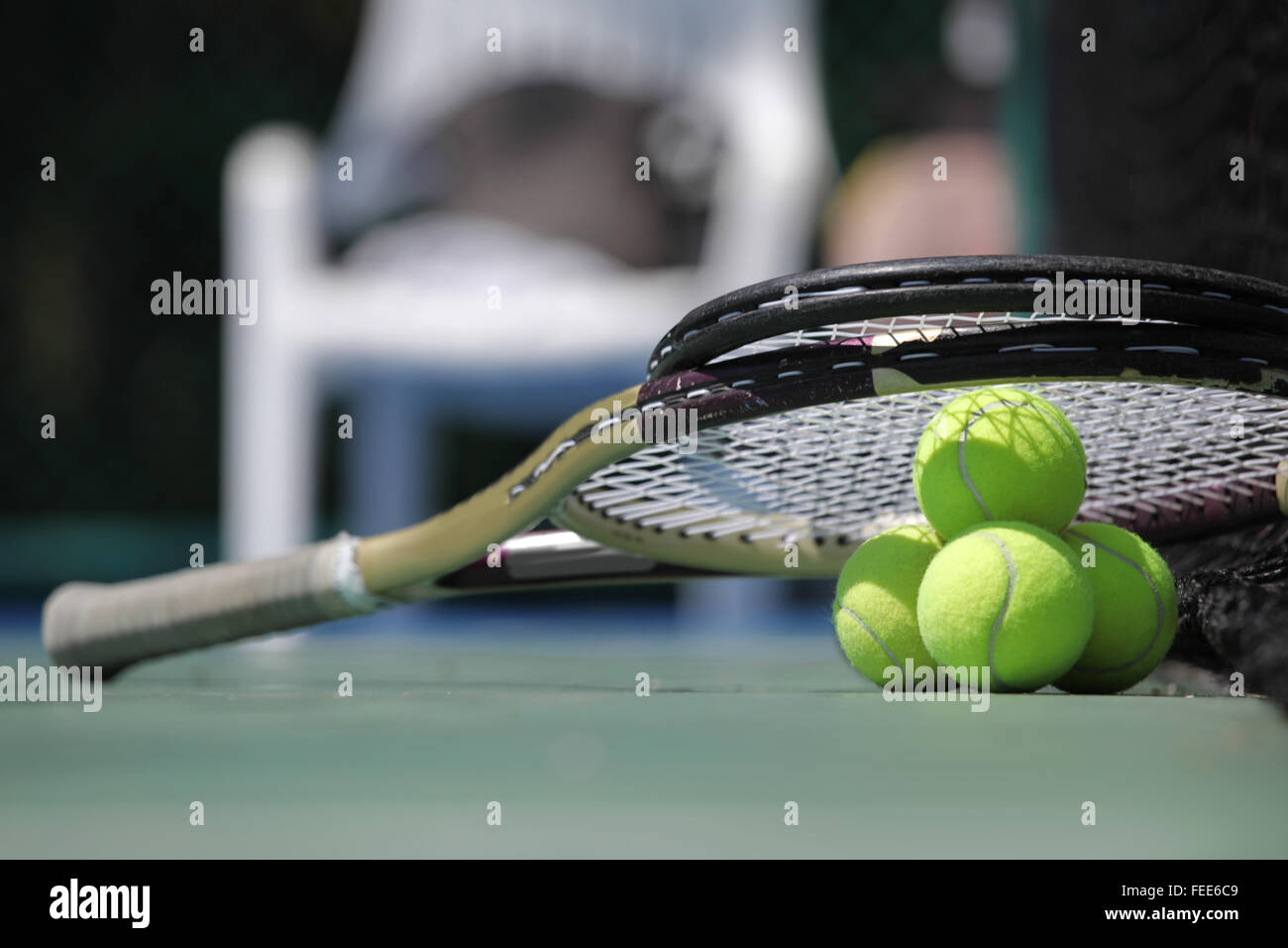 Tennis ball and racket on court close up Stock Photo - Alamy