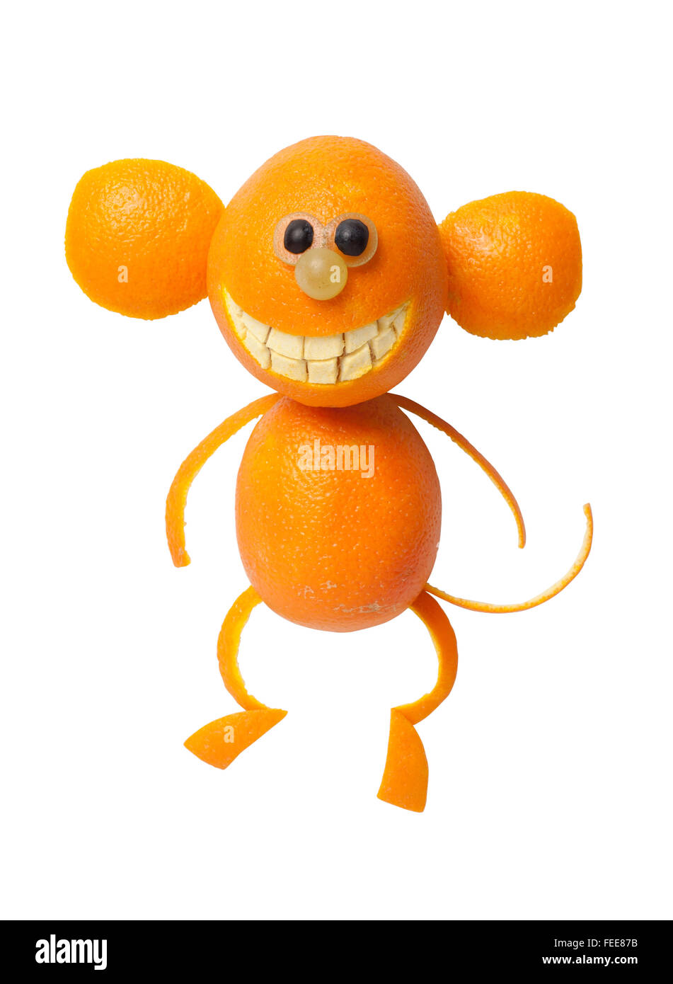 Monkey made of orange rind on isolated background Stock Photo - Alamy