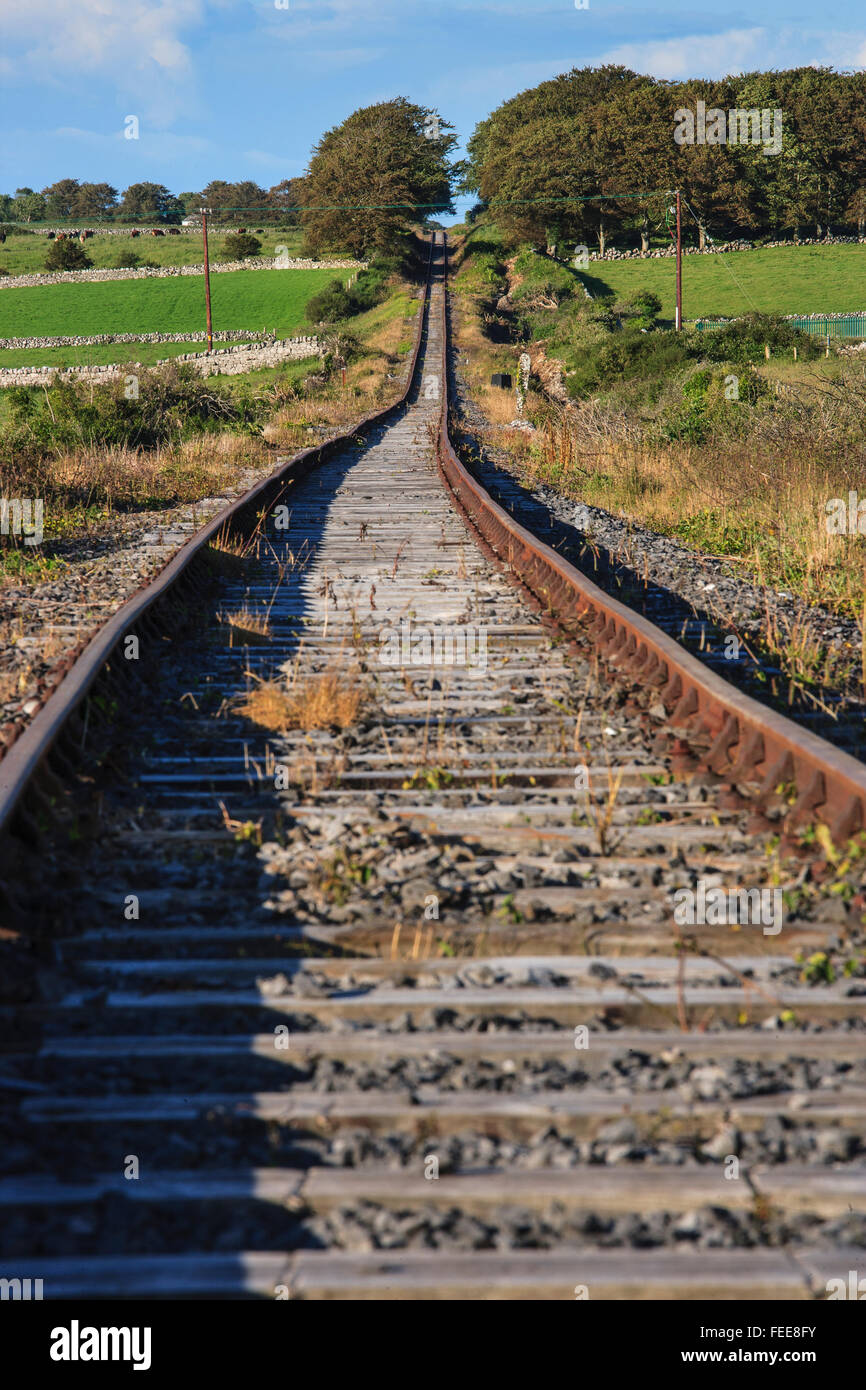 railway tracks track straight line horizon fields Stock Photo - Alamy