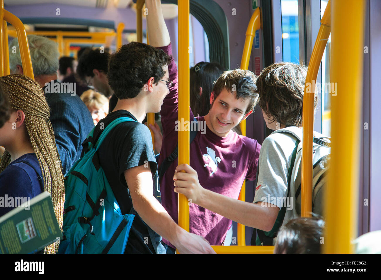 LUAS interior tram boys commuters passengers train Stock Photo - Alamy