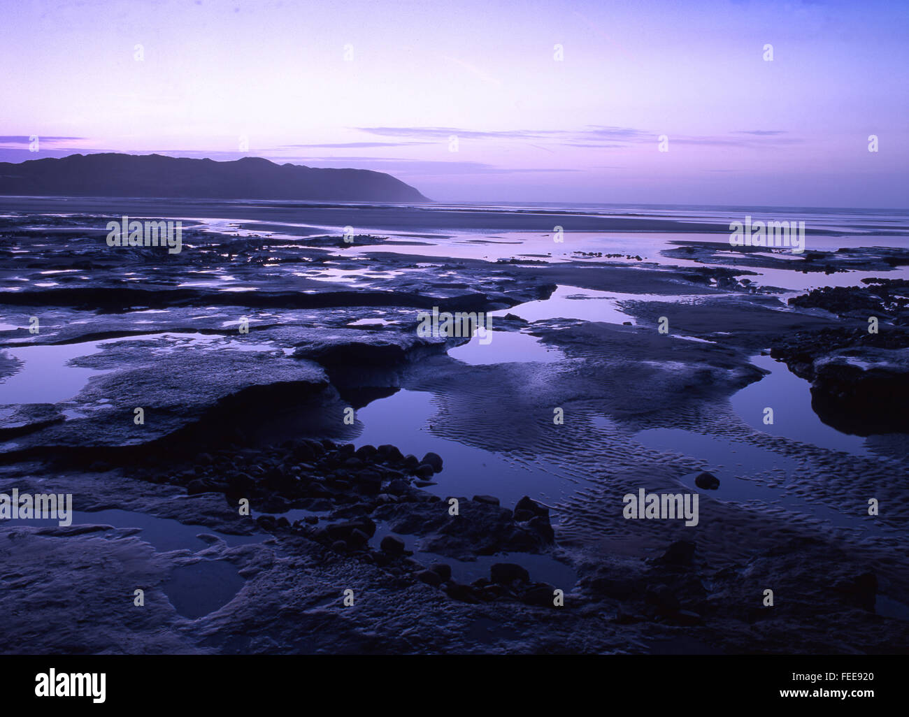Broughton Bay beach rockpools rock pools at sunset dusk Gower Peninsula ...