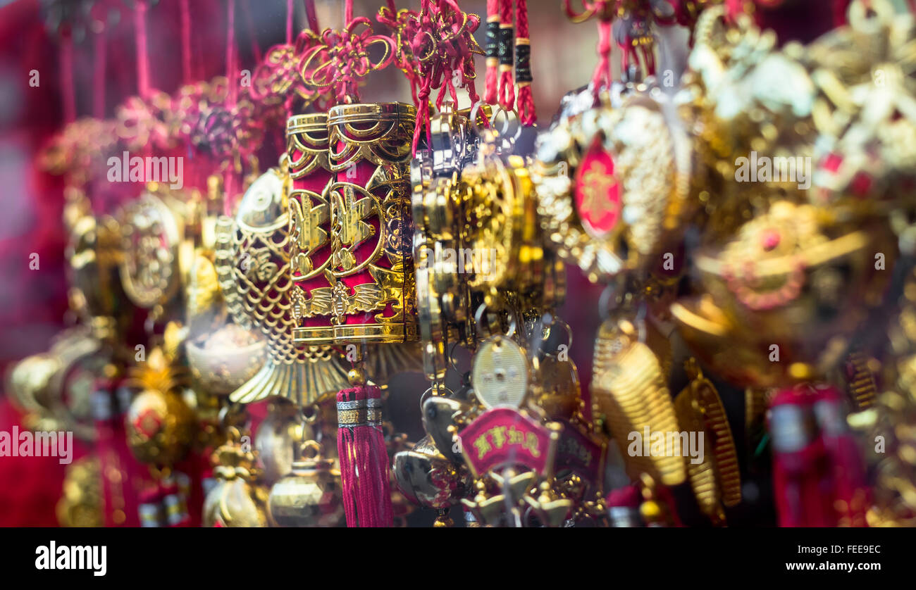 Various Chinese decorations for sale hanging in a shop window Stock ...