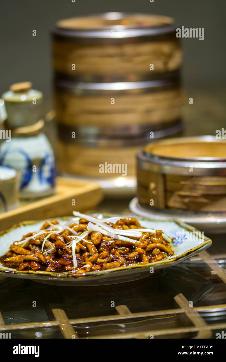 sichuan chicken meat, traditional chinese dish on black background ...