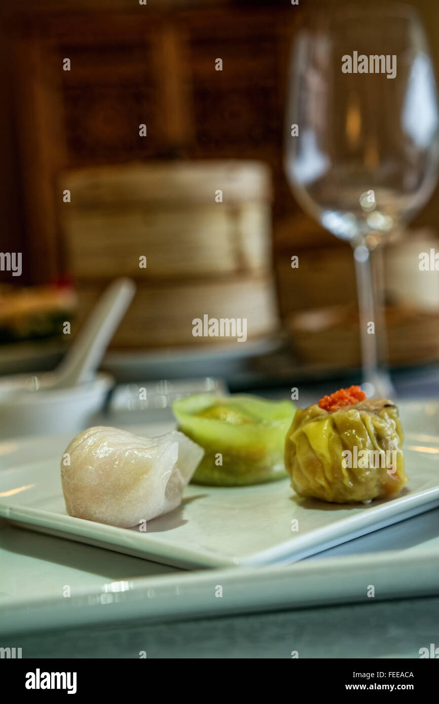 Dim Sum traditional chinese starter with cooking bamboo basket on ...