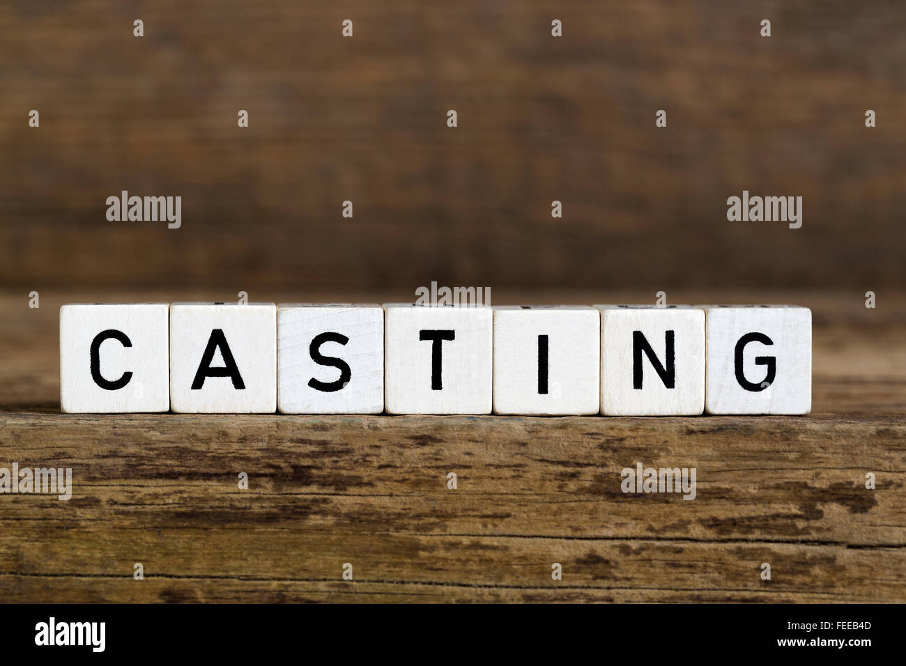 The word casting written in cubes on a wooden background Stock Photo ...
