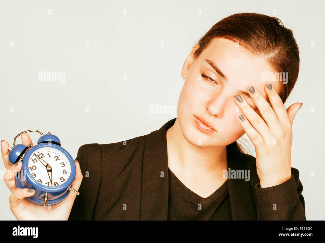 young beauty woman in business style costume waking up for work early ...