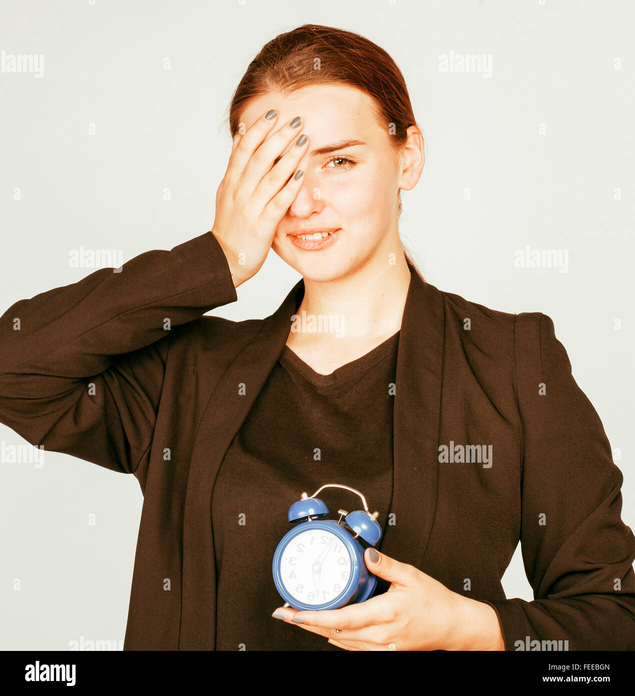 young beauty woman in business style costume waking up for work early ...
