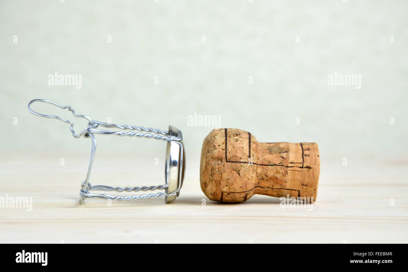 Champagne cork and wire cap on wooden table Stock Photo - Alamy
