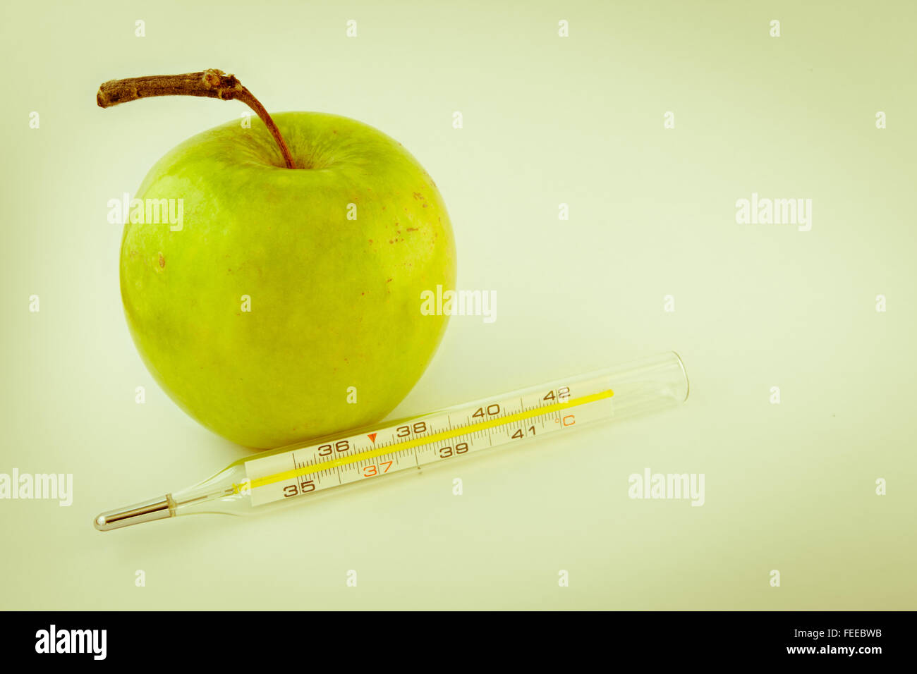 Green apple and thermometer Stock Photo - Alamy