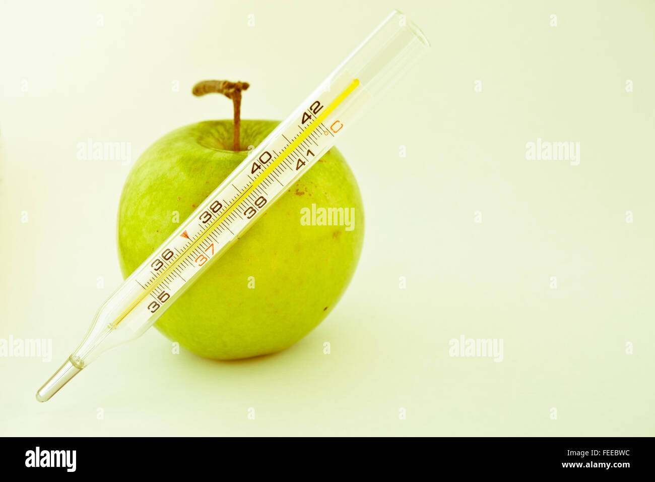 Green apple and thermometer Stock Photo - Alamy
