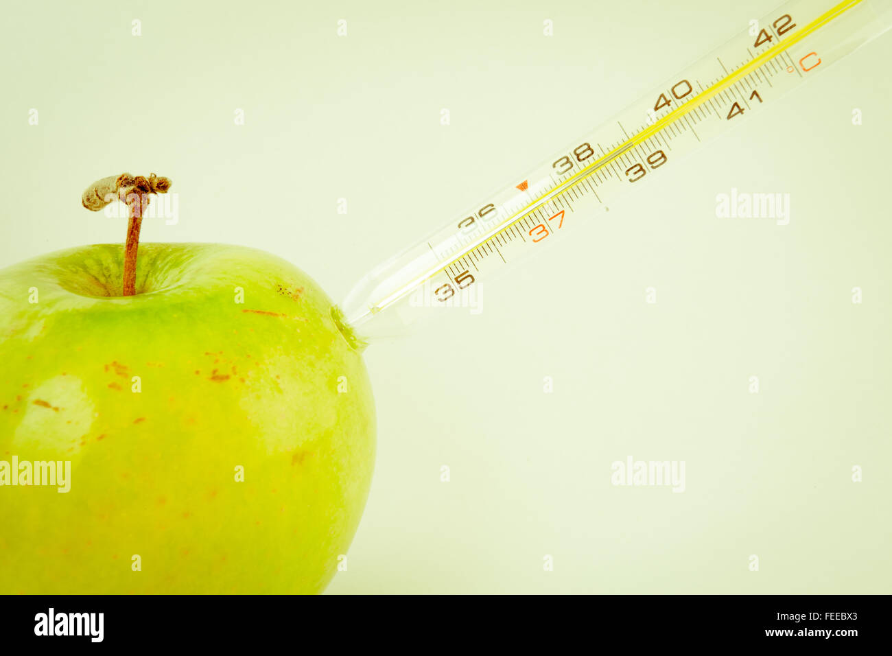 Green apple and thermometer Stock Photo - Alamy