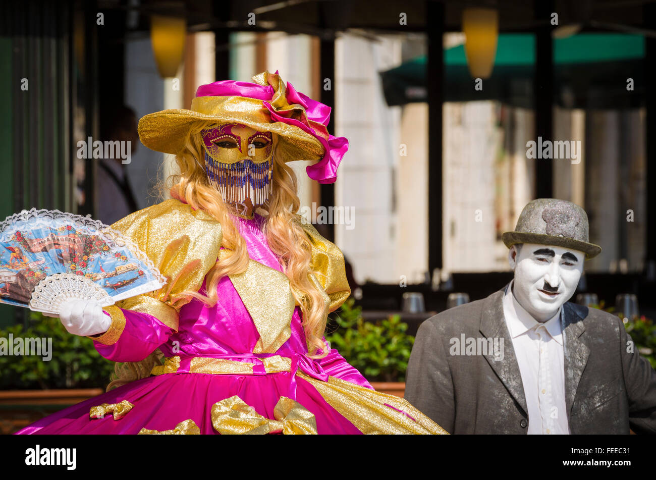 Woman in Carnival dress and Charlie Chaplin mime, Venice, Veneto, Italy ...